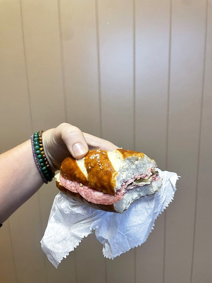 The humble sandwich elevated to art form—pretzel bread cradles savory fillings in a handheld masterpiece that makes lunch hour feel like a European vacation.