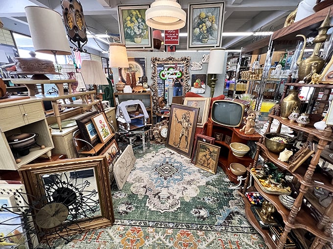 Mid-century treasures mingle with Victorian elegance in this booth, where vintage televisions remind us when "changing channels" required actual movement.