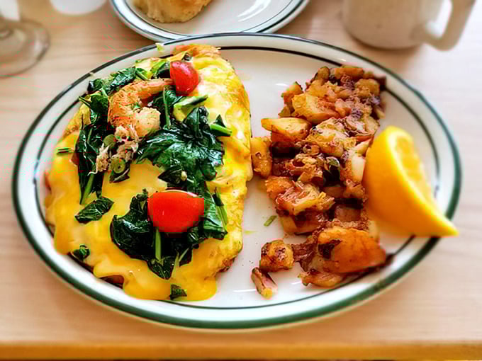 Where grits meet omelet excellence. The side-by-side plating isn't just presentation—it's a strategy for optimal enjoyment of two breakfast superstars.