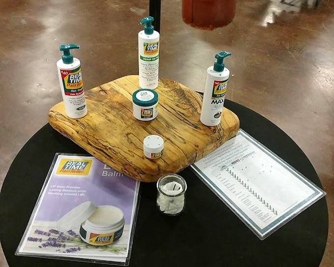 Pain relief products arranged like museum pieces on spalted wood—proof that even practical purchases can be displayed with artistic flair.
