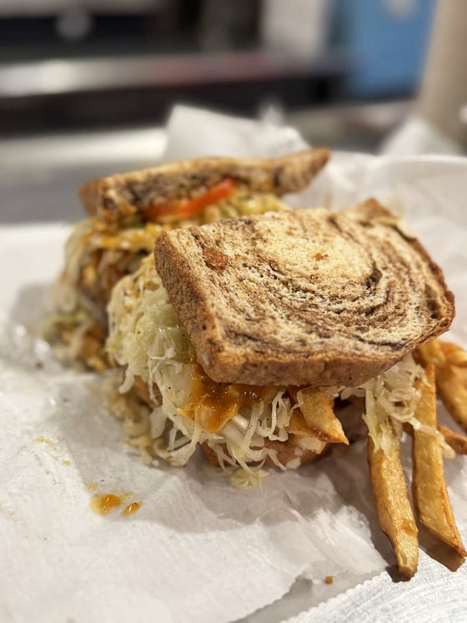 The Reuben here doesn't follow rules; it makes them, with coleslaw and fries joining the party uninvited but welcome.