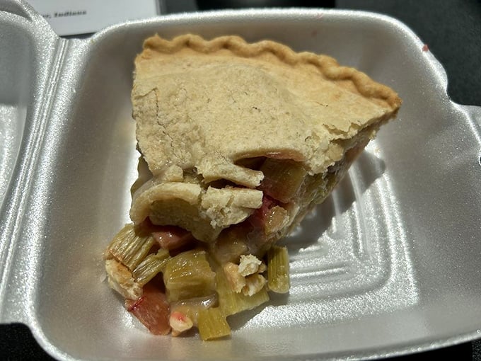 Rhubarb pie in its takeout container—proof that some of life's greatest pleasures are meant to be enjoyed at home in pajamas.