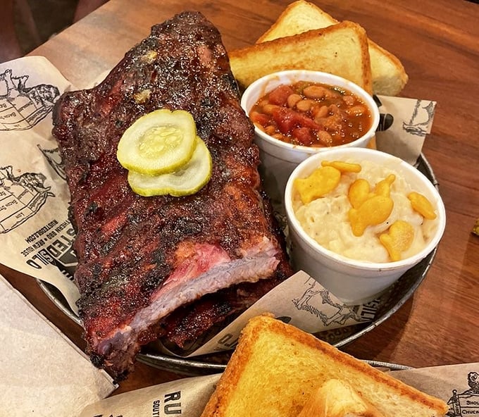 Ribs with the perfect bark-to-meat ratio, where the smoke ring isn't just visible—it's practically showing off for the camera.
