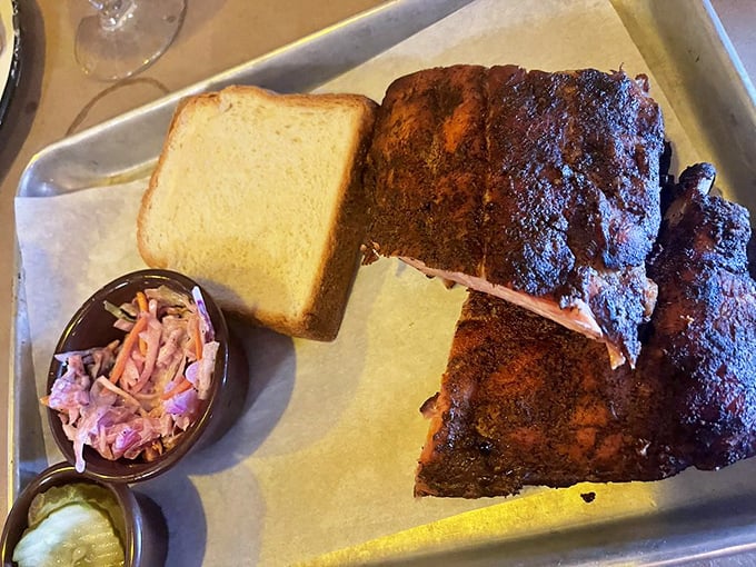 These ribs don't "fall off the bone"—they resist just enough to remind you that proper barbecue requires both science and soul.