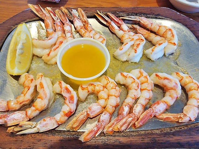 Royal Red shrimp arranged like a sunburst of seafood delight. The melted butter isn't optional—it's essential for the full experience.