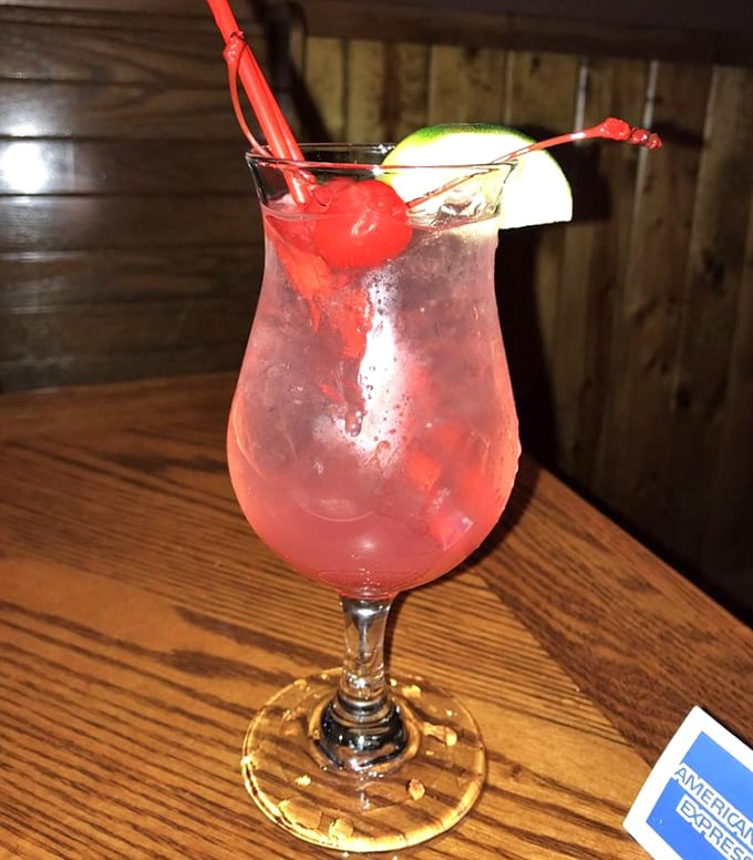 A cocktail that says "vacation mode activated" even if you're just 30 minutes from home. That cherry and lime aren't just garnish – they're a promise of good times ahead.