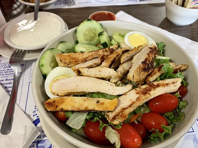 Even the salads here mean business—grilled chicken, fresh vegetables, and hard-boiled eggs create a protein powerhouse that doesn't feel like punishment.
