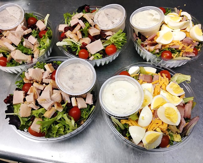 Even the salads get the smokehouse treatment—proof that vegetables can find happiness in BBQ paradise when properly introduced to smoked meat.