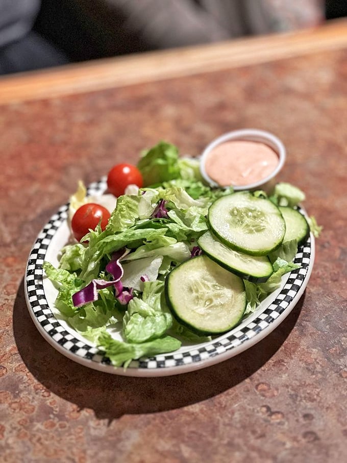 A garden-fresh side salad that proves vegetables can be more than an obligation—crisp, colorful, and the perfect counterpoint to diner indulgence.