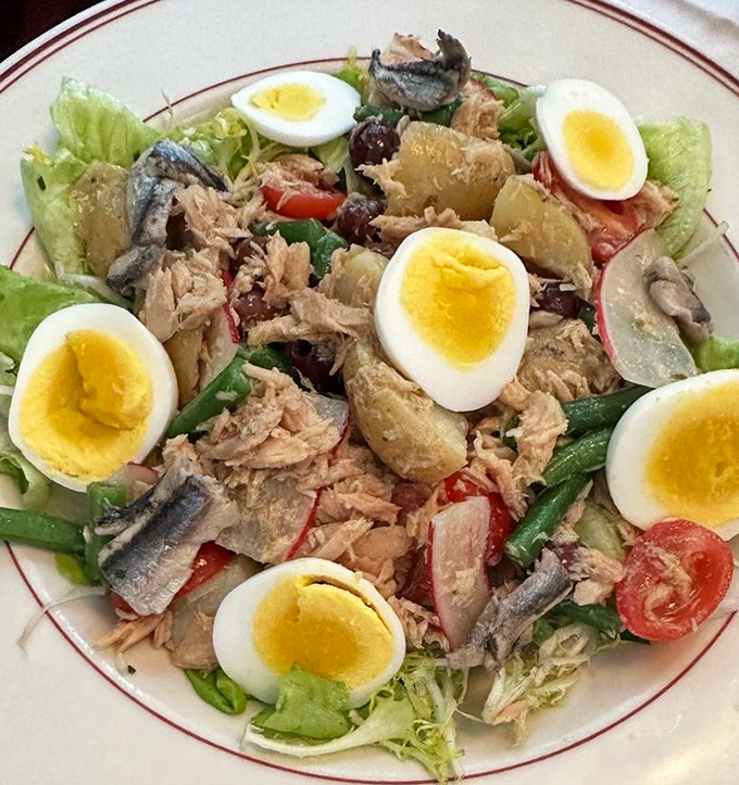 Niçoise salad arranged with such care you almost feel bad dismantling it. Almost.