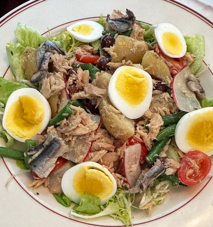 Niçoise salad arranged with such care you almost feel bad dismantling it. Almost.