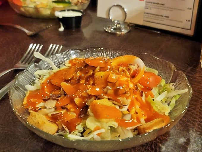 Even the salad gets the royal treatment – a colorful confetti of fresh ingredients dressed with the kind of care usually reserved for main courses.