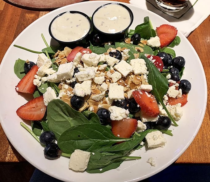 A fresh spinach salad that proves vegetables can be exciting too – especially when feta, berries, and nuts join the party.