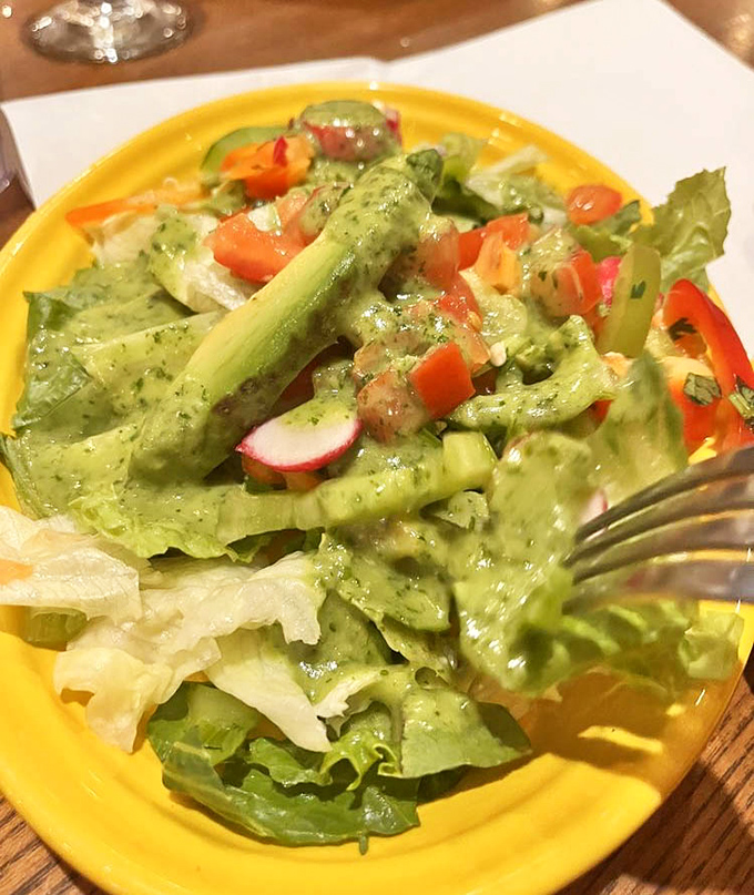 A salad that doesn't apologize for being a salad. That vibrant green dressing isn't just playing dress-up—it's bringing serious flavor to the party.