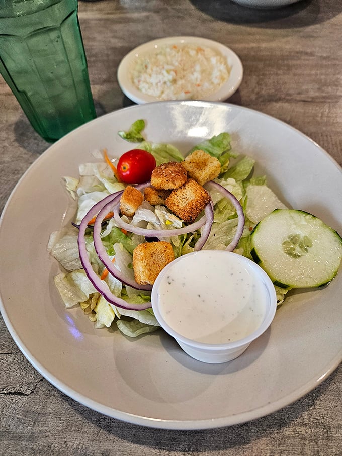 A garden-fresh salad that proves diners can do vegetables right—crisp, colorful, and waiting for that house dressing to tie it all together.