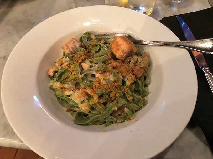 Green pasta that would make Dr. Seuss proud. This salmon alfredo isn’t just food; it’s edible art with a side of comfort.