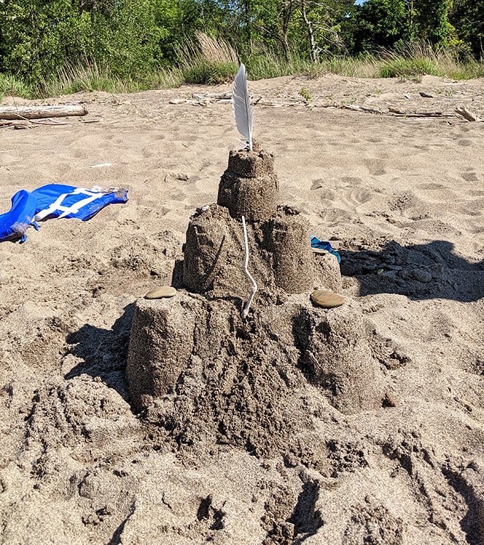 Every great beach day deserves a great sandcastle—this feather-topped creation wouldn't survive high tide, but it's architectural ambition is admirable.