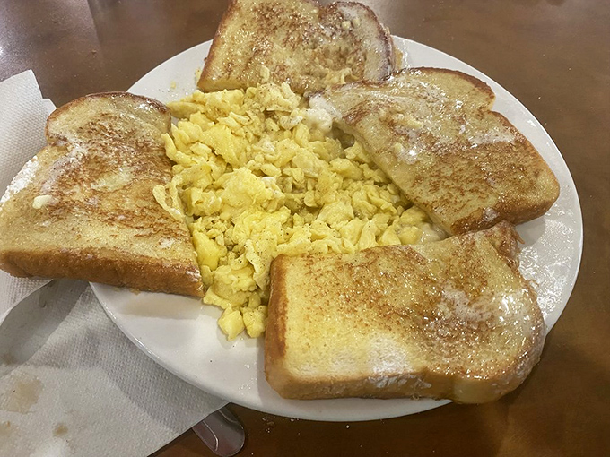 Scrambled eggs surrounded by a golden-brown toast fortress. Morning comfort that whispers, "Everything's going to be okay today."