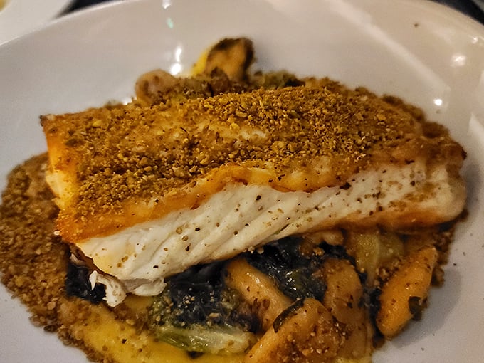 Crispy-skinned sea bass perched atop mushrooms like culinary royalty—proof that simplicity executed perfectly is the highest form of cooking.