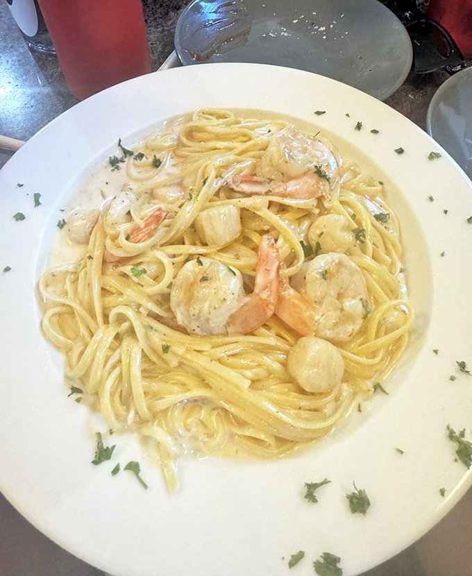 Creamy Alfredo sauce coating tender shrimp and scallops over linguine—comfort food that feels like a warm Italian hug.
