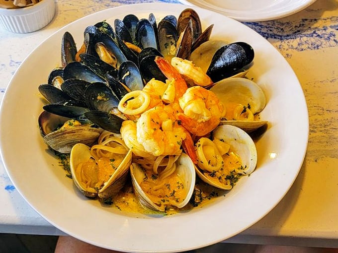 A seafood linguine that's basically an underwater neighborhood block party. Everyone's invited – mussels, clams, shrimp – and they all brought sauce!