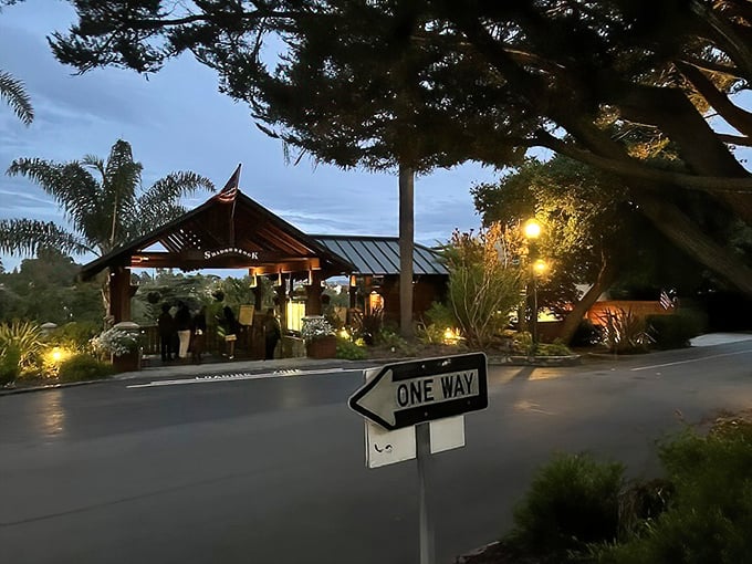 Shadowbrook Restaurant's entrance promises a dining experience as memorable as the journey to reach it—down a hillside path into culinary enchantment.