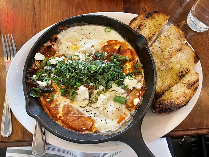 This skillet of bubbling eggs, tomato sauce, and cheese isn't just breakfast—it's the kind of dish that makes you reconsider your life choices.