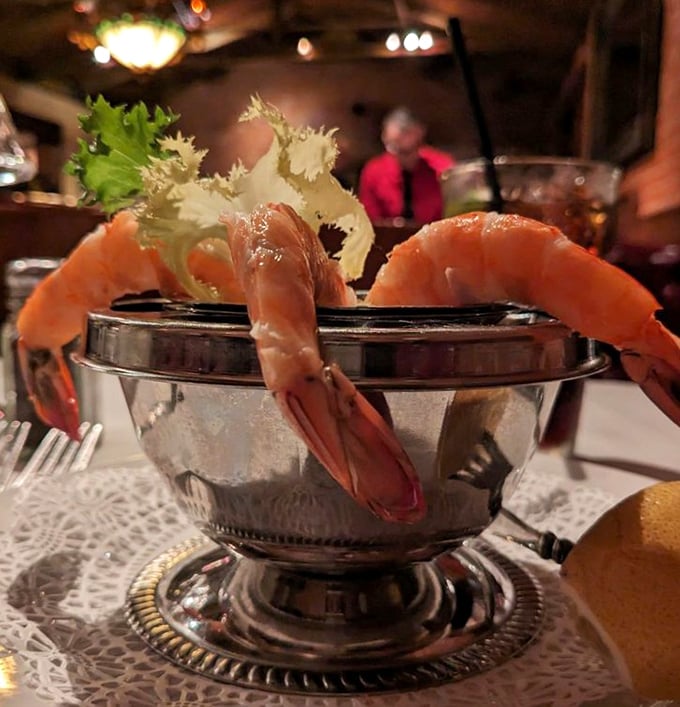 Shrimp cocktail served with old-school glamour—these crustaceans are dressed better than most people at the Oscars.