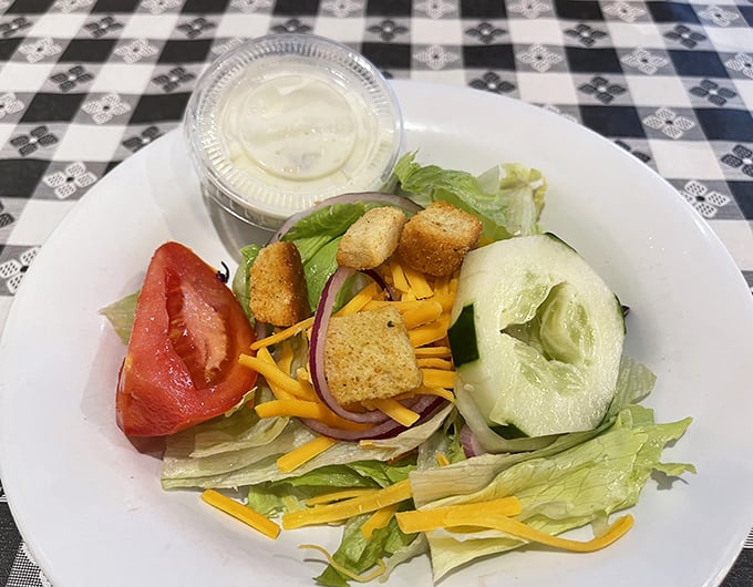 Even the side salad gets special attention here—crisp, colorful, and a noble companion for those moments when you pretend to be virtuous.
