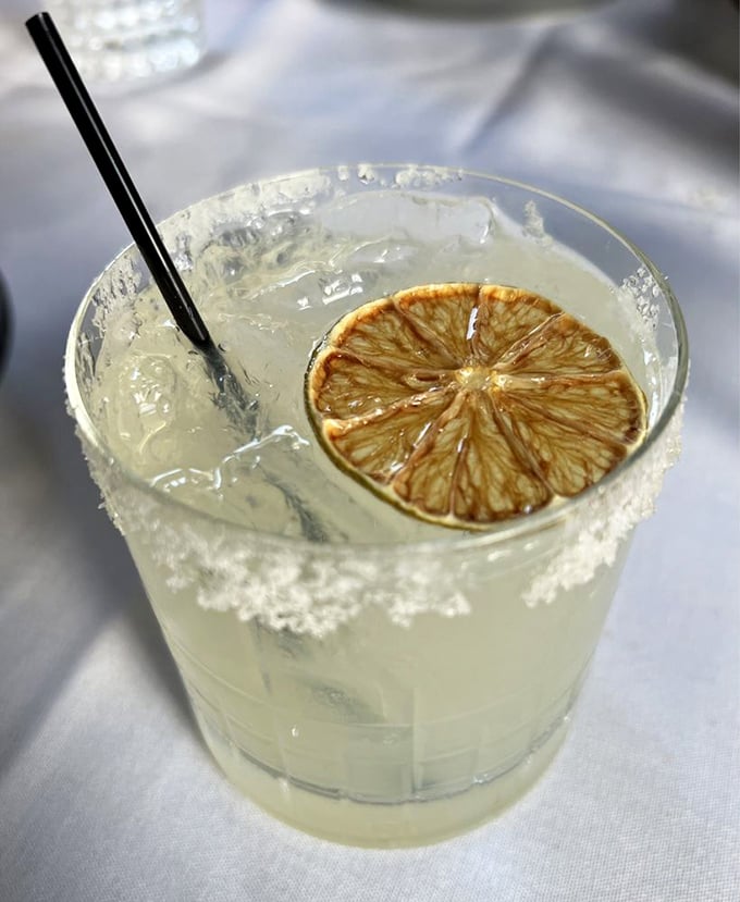 A margarita with a perfectly dehydrated lime wheel—because sometimes you need something bright and zippy to cut through all that glorious seafood richness.