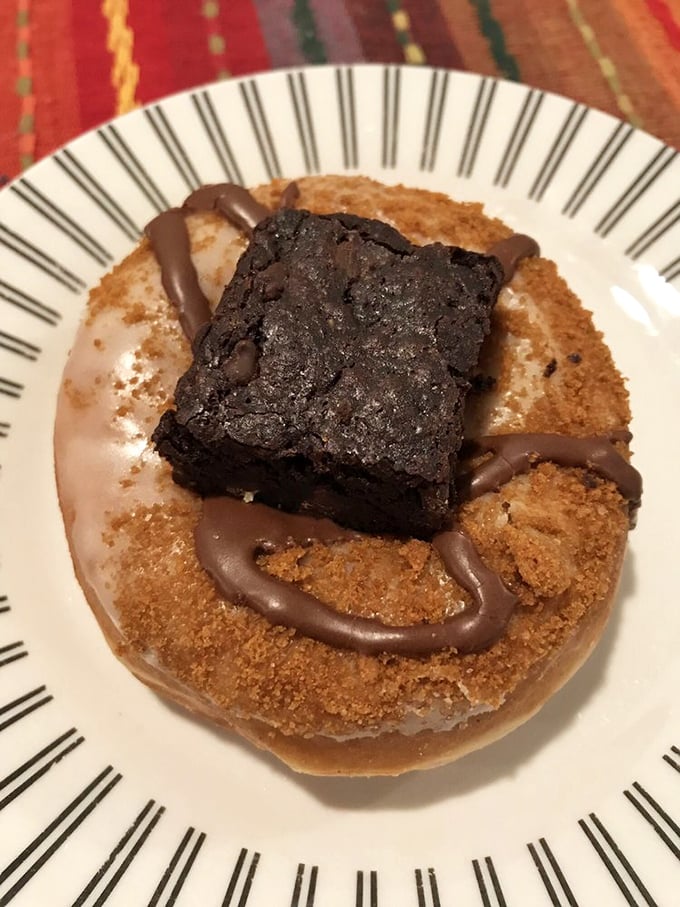Dessert inception: a donut topped with brownie and chocolate drizzle that makes you wonder why this combination isn't more common.