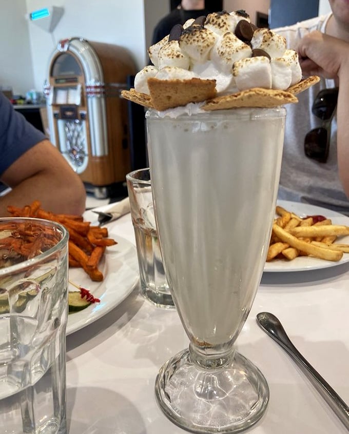 Not just a milkshake, but a dessert skyscraper topped with a village of toasted marshmallows and graham crackers. Spoon or straw? Both, please!