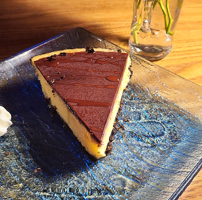 This slice of sour orange pie with its chocolate drizzle isn't just dessert—it's Florida sunshine translated into creamy, citrusy perfection.