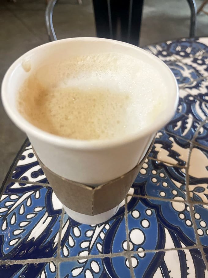Coffee served on a handcrafted mosaic table—because sometimes the vessel and setting are as important as what's inside the cup.