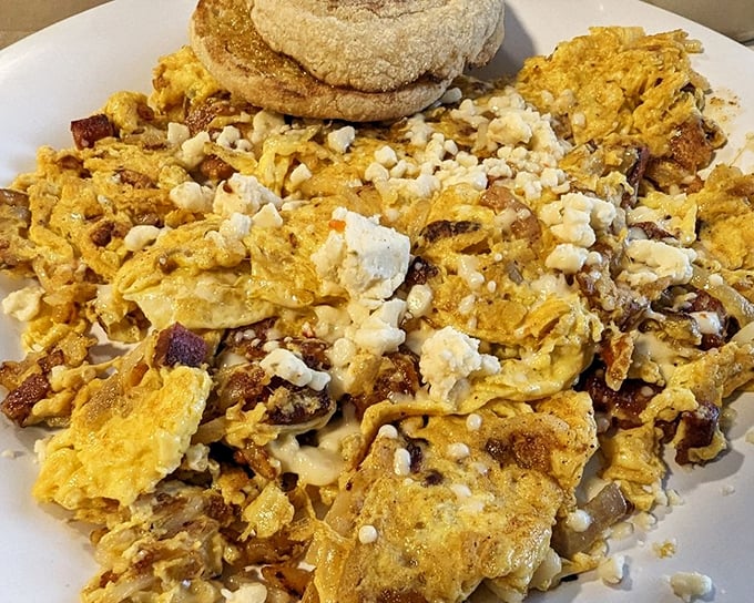 This isn't just a "trash plate"—it's a beautiful chaos of eggs, cheese, and potatoes that somehow makes perfect sense at 9 AM.