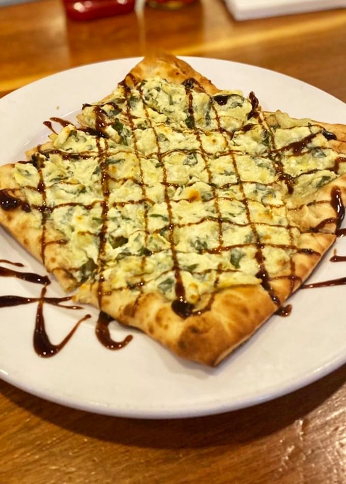 Flatbread that proves vegetables can party too. That balsamic drizzle is like the perfect accessory—it completes the outfit without showing off.