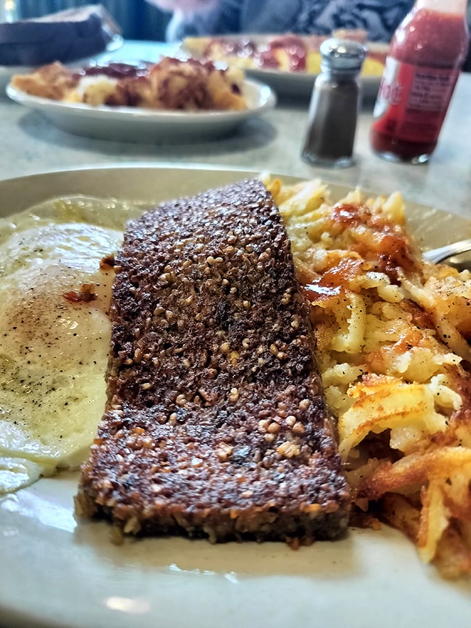 The classic diner trifecta – seasoned steak, golden hash browns, and eggs – proving that sometimes the simplest combinations are culinary perfection.