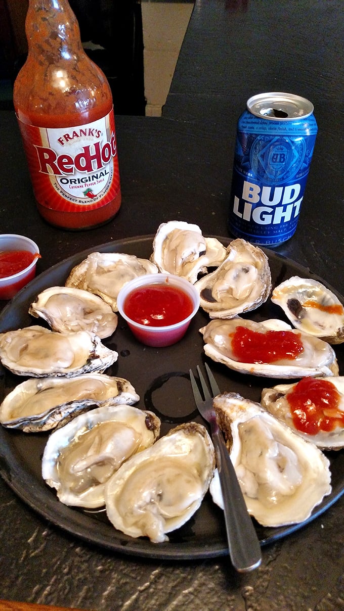Fresh oysters on the half shell with a cold Bud Light—proof that sometimes the simplest pleasures are the most profound. Just add hot sauce and repeat.