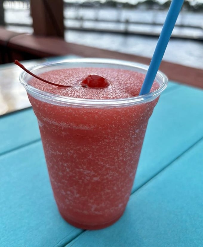 A strawberry daiquiri that tastes like summer vacation in a glass – the kind that makes you forget emails exist.