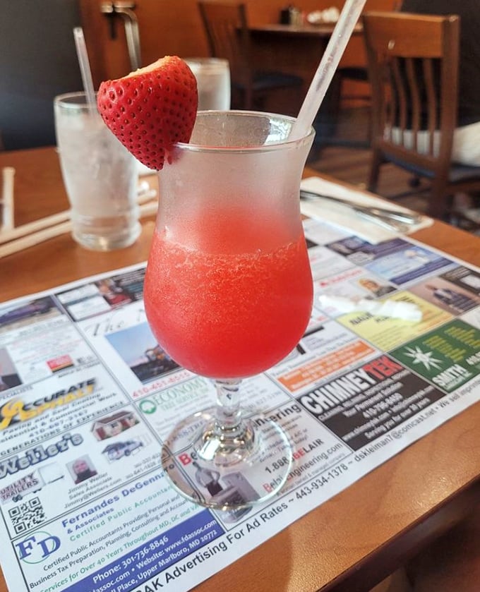 Not just a strawberry daiquiri—it's summer in a glass, complete with a berry sentinel standing watch over your refreshment.