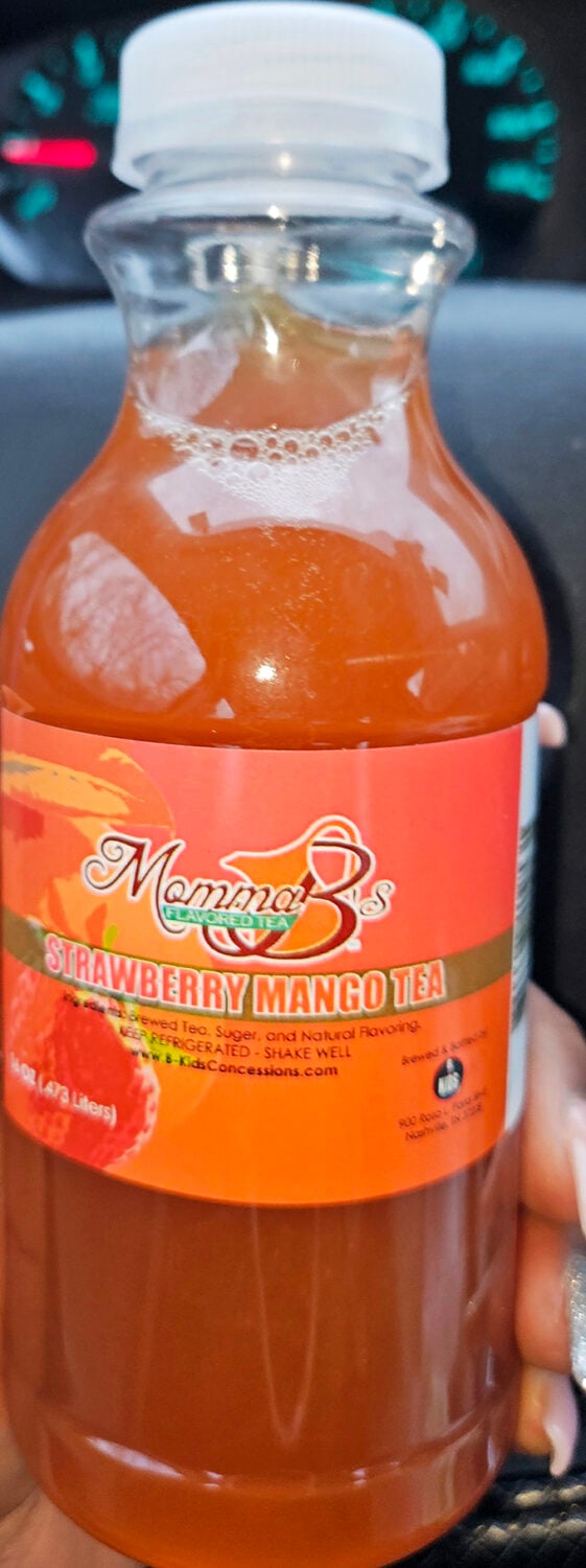The strawberry mango tea comes in a bottle labeled "Momma B's"—because every great fish sandwich deserves an equally impressive beverage companion.