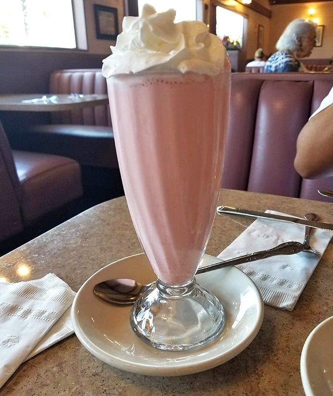 This strawberry milkshake isn't just a drink—it's dessert with a straw. The whipped cream mountain on top is non-negotiable.