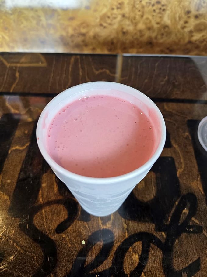This strawberry shake isn't just pink – it's the blush of first love, the color of promises that, unlike relationships, this one will definitely satisfy.