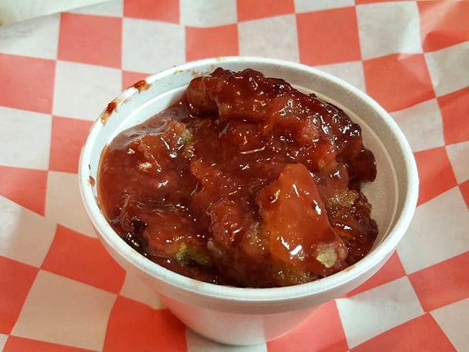 This isn't just cobbler – it's summer captured in a cup. Fruit and sauce mingling like old friends at a reunion.
