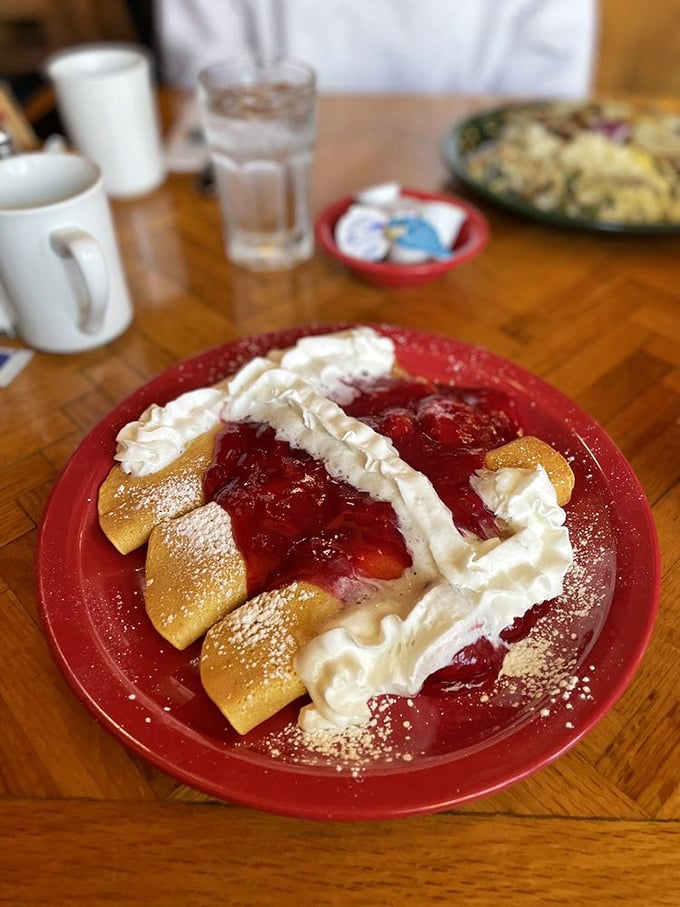 These strawberry crepes look like they're dressed for a red-carpet event, with whipped cream and powdered sugar adding just the right amount of glamour.