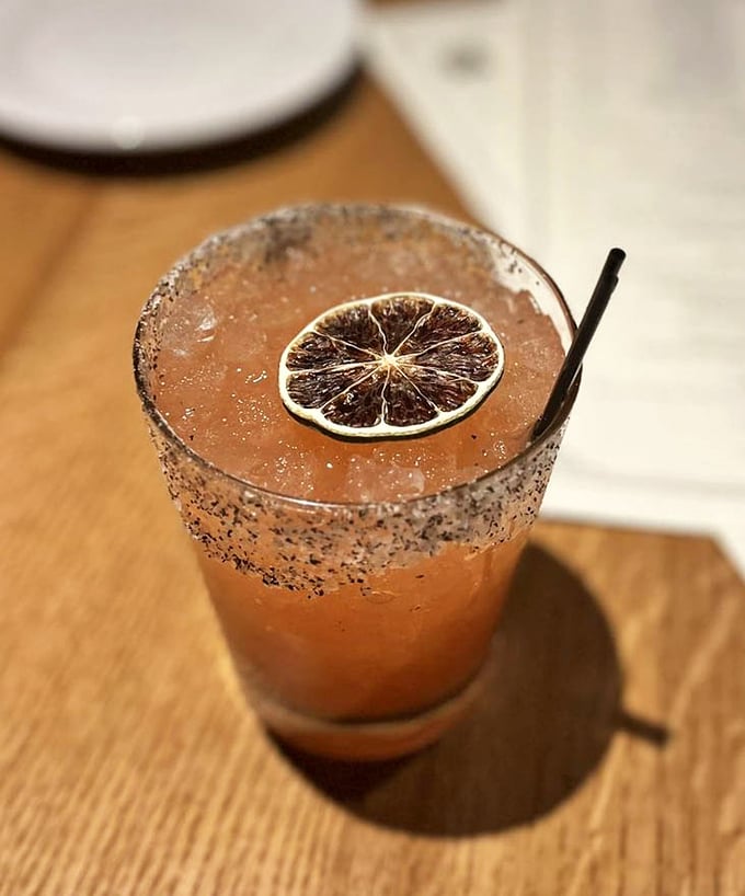 This cocktail isn't just pretty—it's a strawberry jalapeño margarita that delivers sweet heat with every sip of its citrusy goodness.