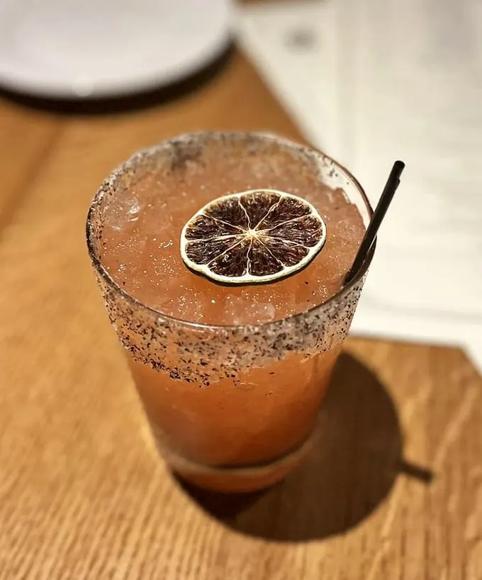 This cocktail isn't just pretty—it's a strawberry jalapeño margarita that delivers sweet heat with every sip of its citrusy goodness.
