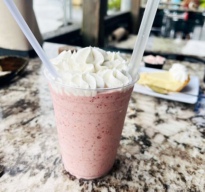 This strawberry milkshake isn't just a drink—it's what happiness would look like if it took liquid form and wore a whipped cream hat.
