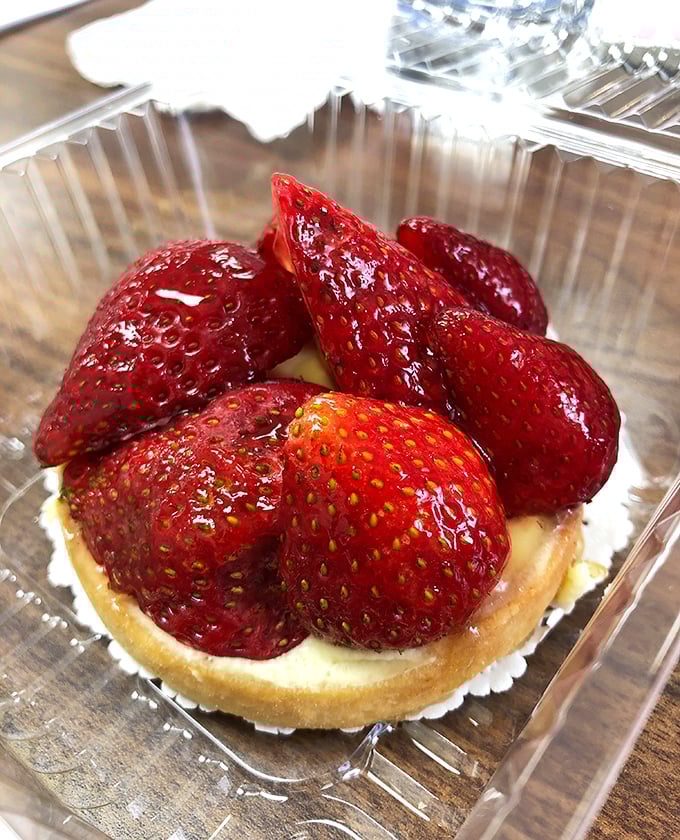This strawberry tart is summer captured in a pastry shell. Those berries aren't just fruit—they're rubies crowning a treasure of sweet custard.