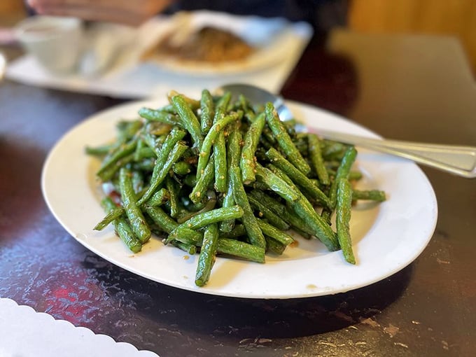 Dry-sautéed string beans that could convert vegetable skeptics into true believers. Blistered, garlicky, and impossibly addictive.